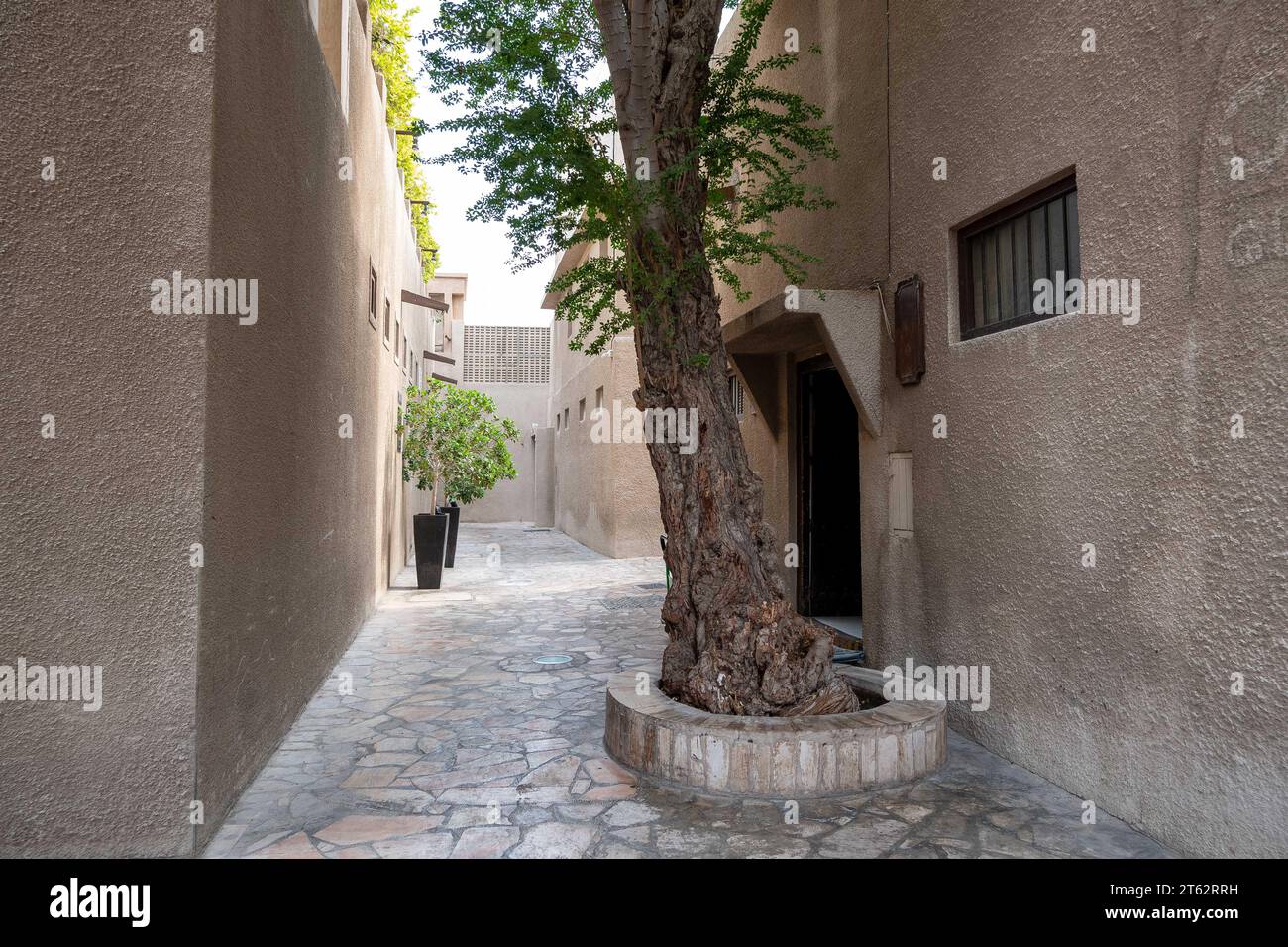 View of narrow clean streets between traditional stone buildings in old ...