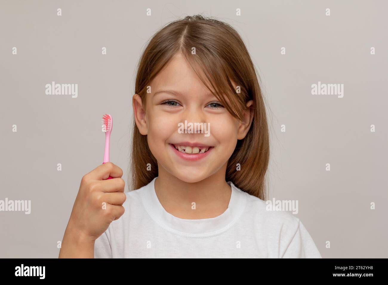 Portrait of caucasian happy little girl with open wide smile showing ...