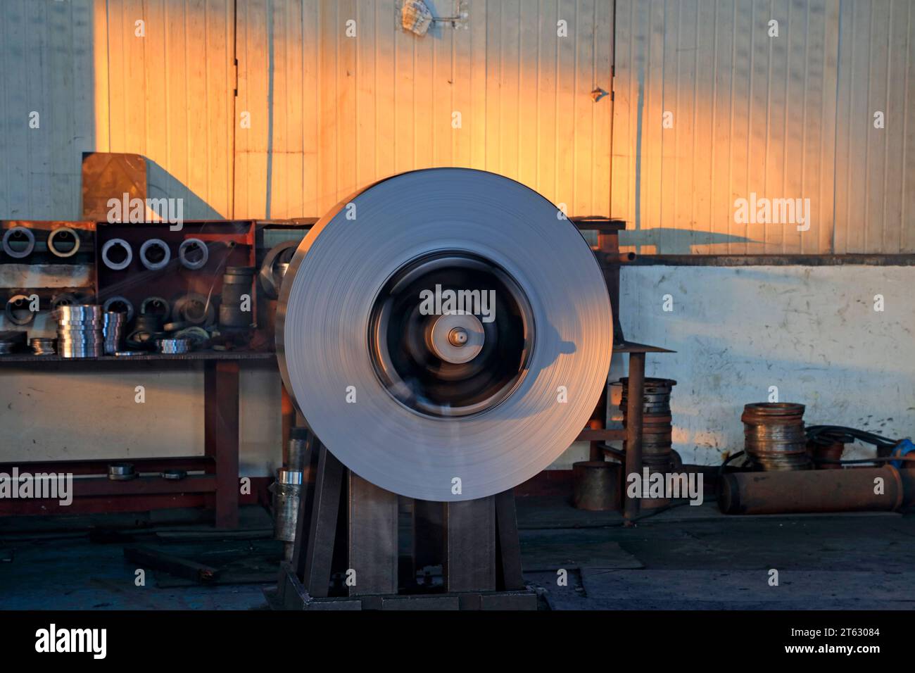 Strip steel in rotation Stock Photo - Alamy