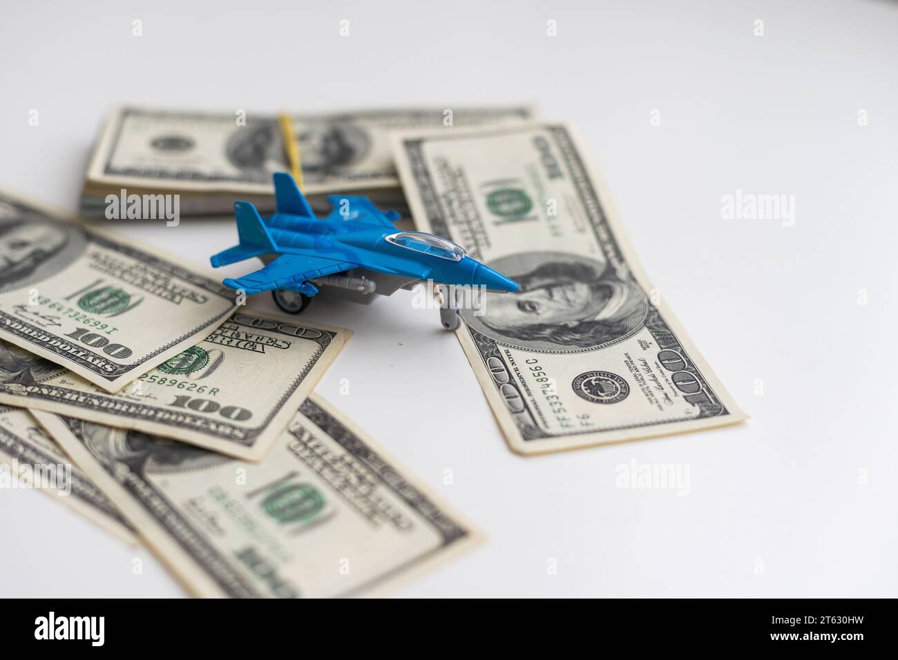 Military toy airplane jet aircraft and dollars - fighter isolated on ...