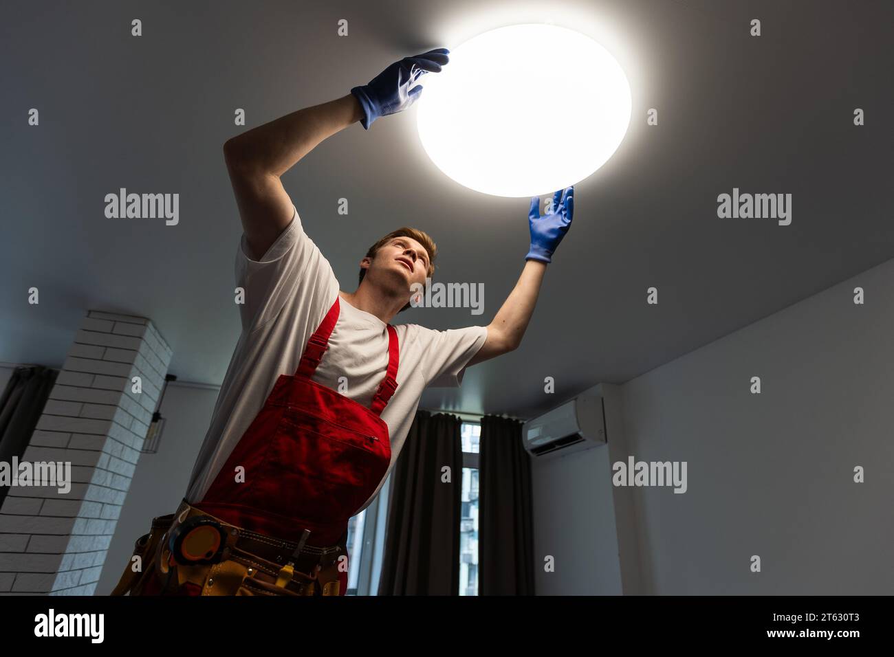Electrician at work. Service for the repair of electrical wiring and ...