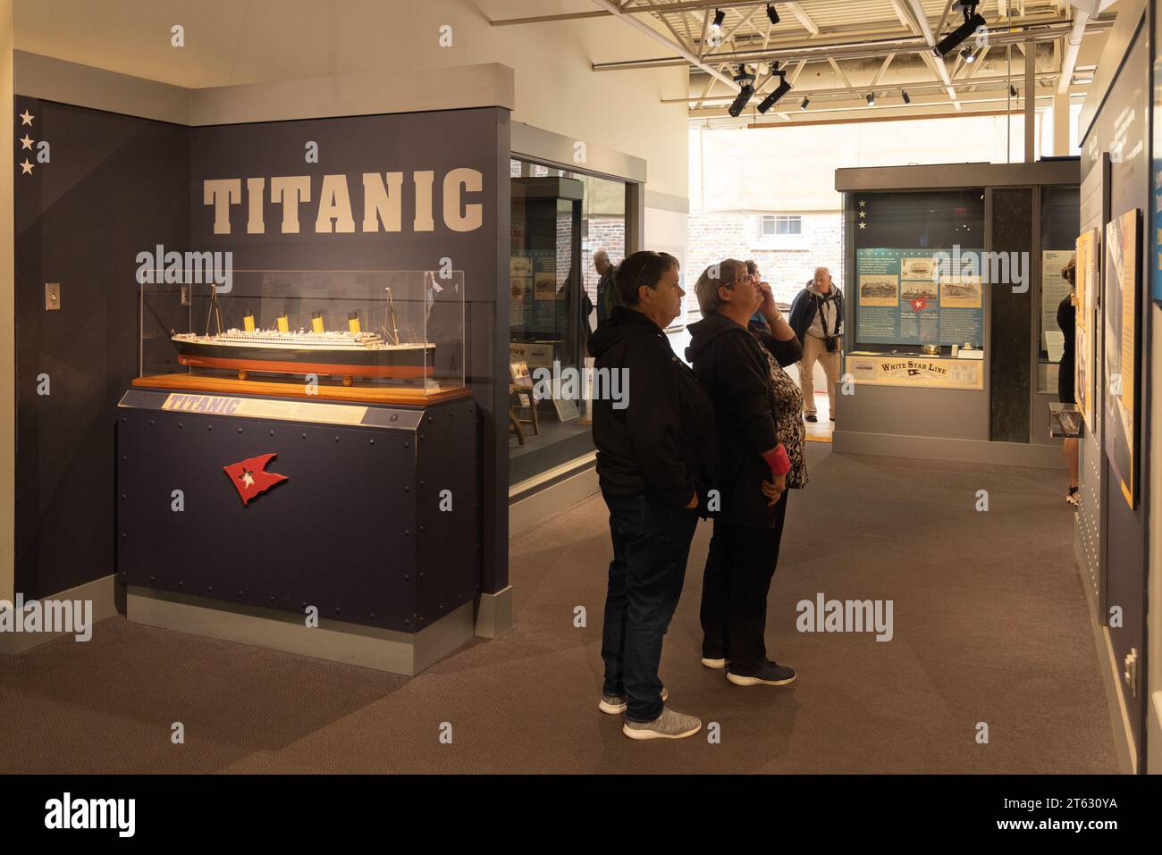 Titanic tourism and travel; Tourists at the entrance to the Titanic Sinking exhibition, Maritime ...