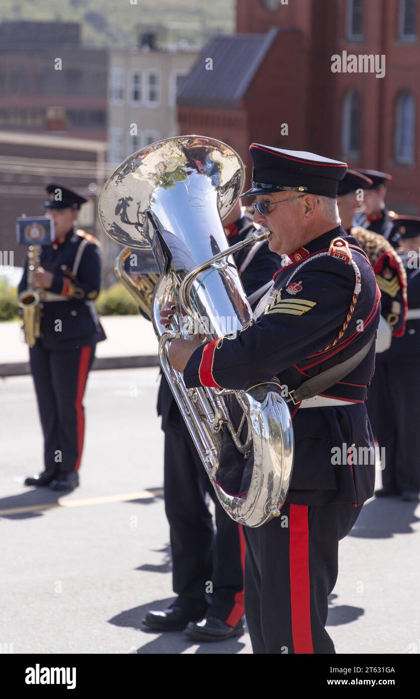 Tuba player; Man playing a Tuba in a Military brass band playing on the ...