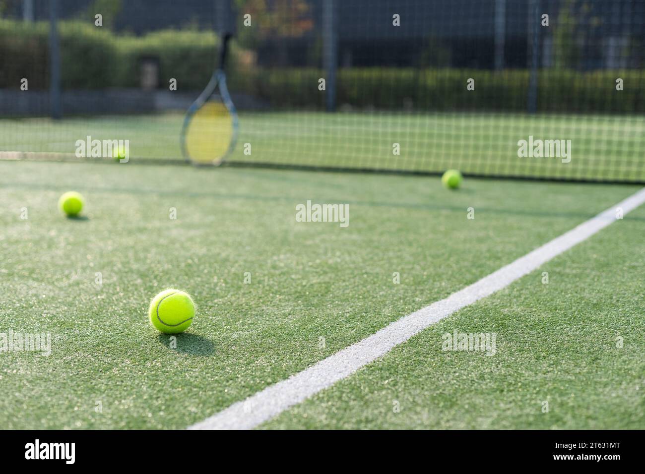 Tennis ball on an empty tennis court Stock Photo - Alamy