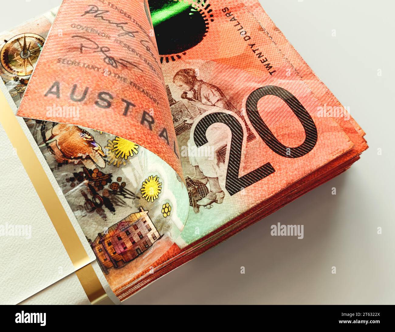 A bundled wad of Australlia Dollar banknotes on an isolated light ...