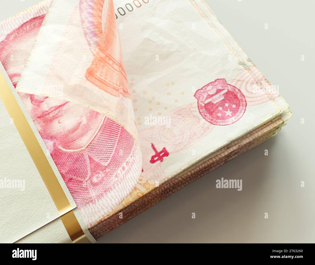 A bundled wad of China Yuan banknotes on an isolated light background ...