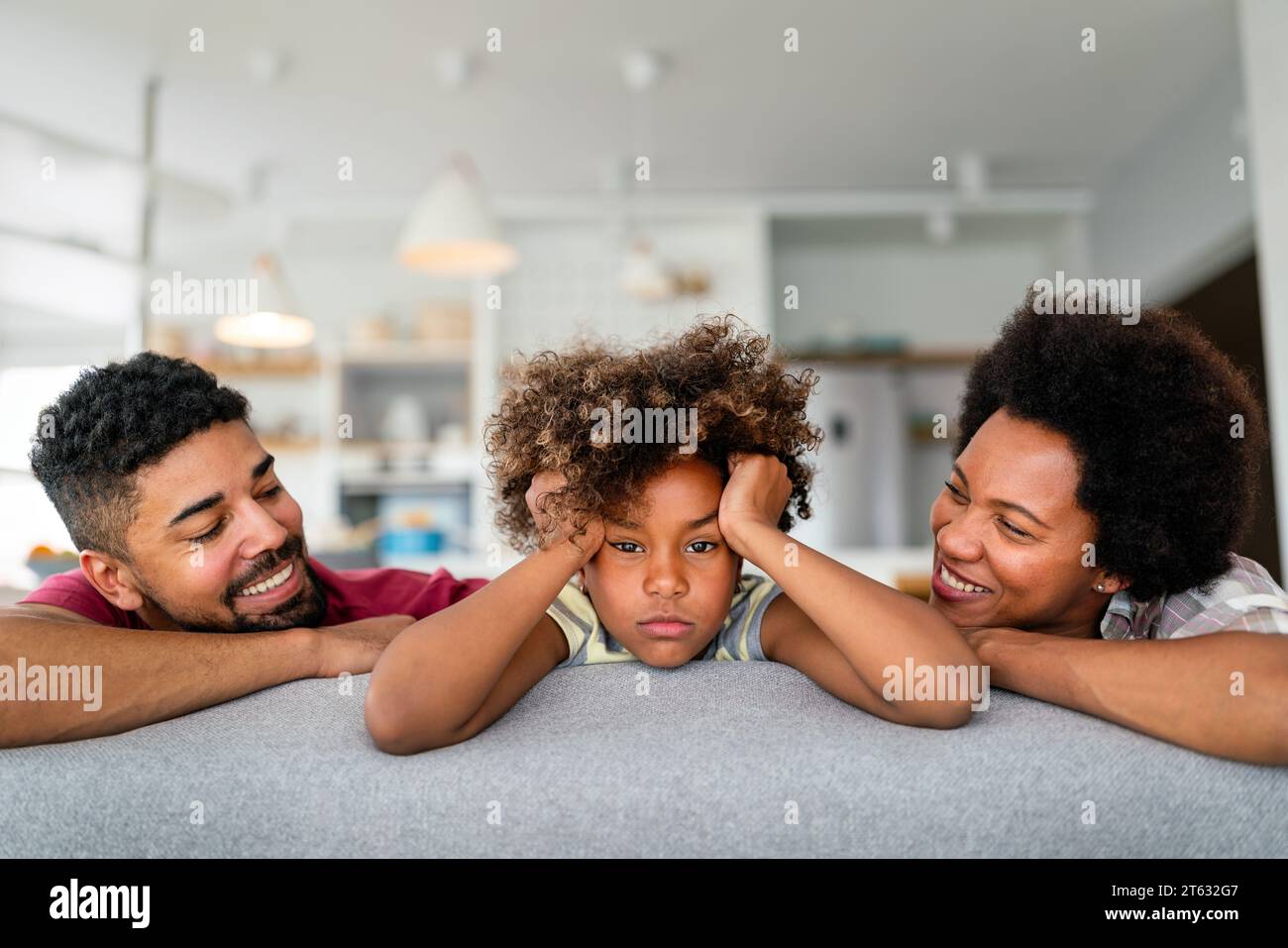 Positive parents and teenage offended daughter at home making peace ...