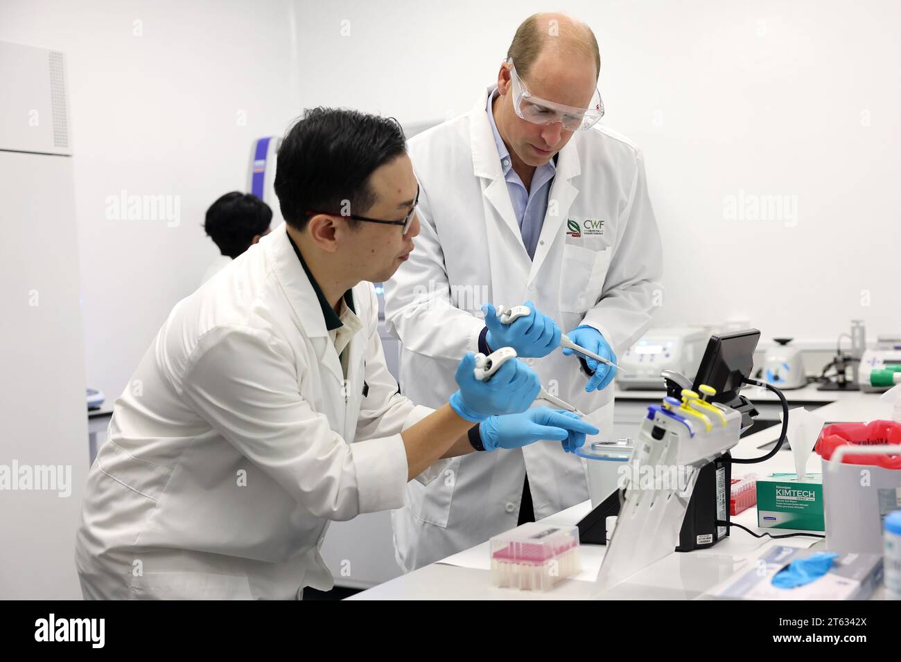 The Prince of Wales wears a lab coat and uses forensic equipment as he ...