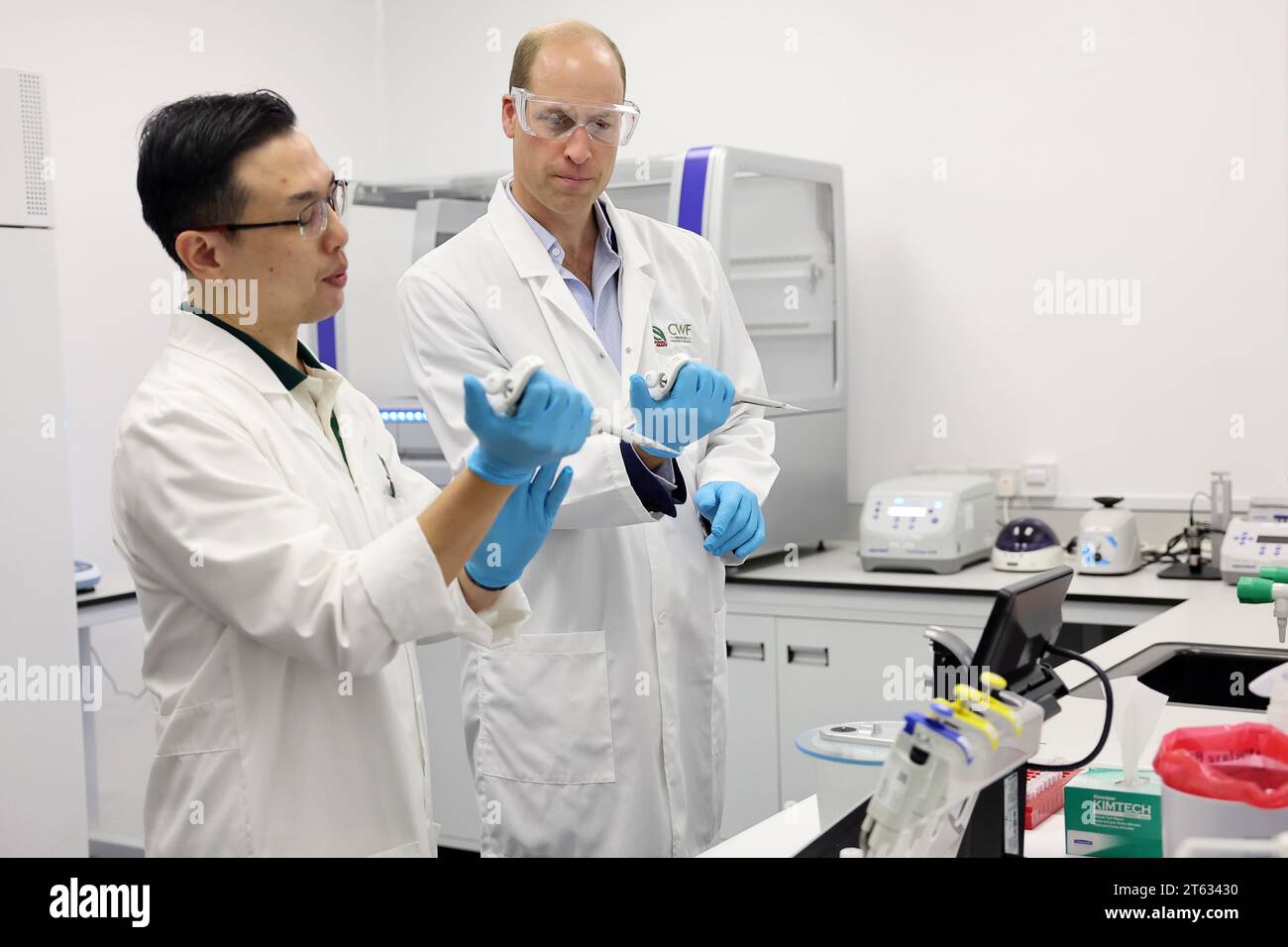 The Prince of Wales wears a lab coat and uses forensic equipment as he ...