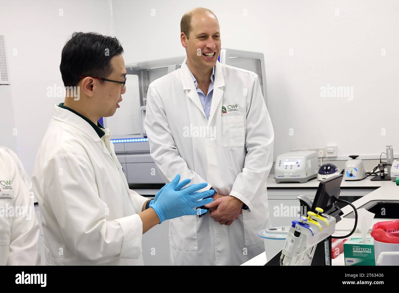 The Prince of Wales wears a lab coat and uses forensic equipment as he ...