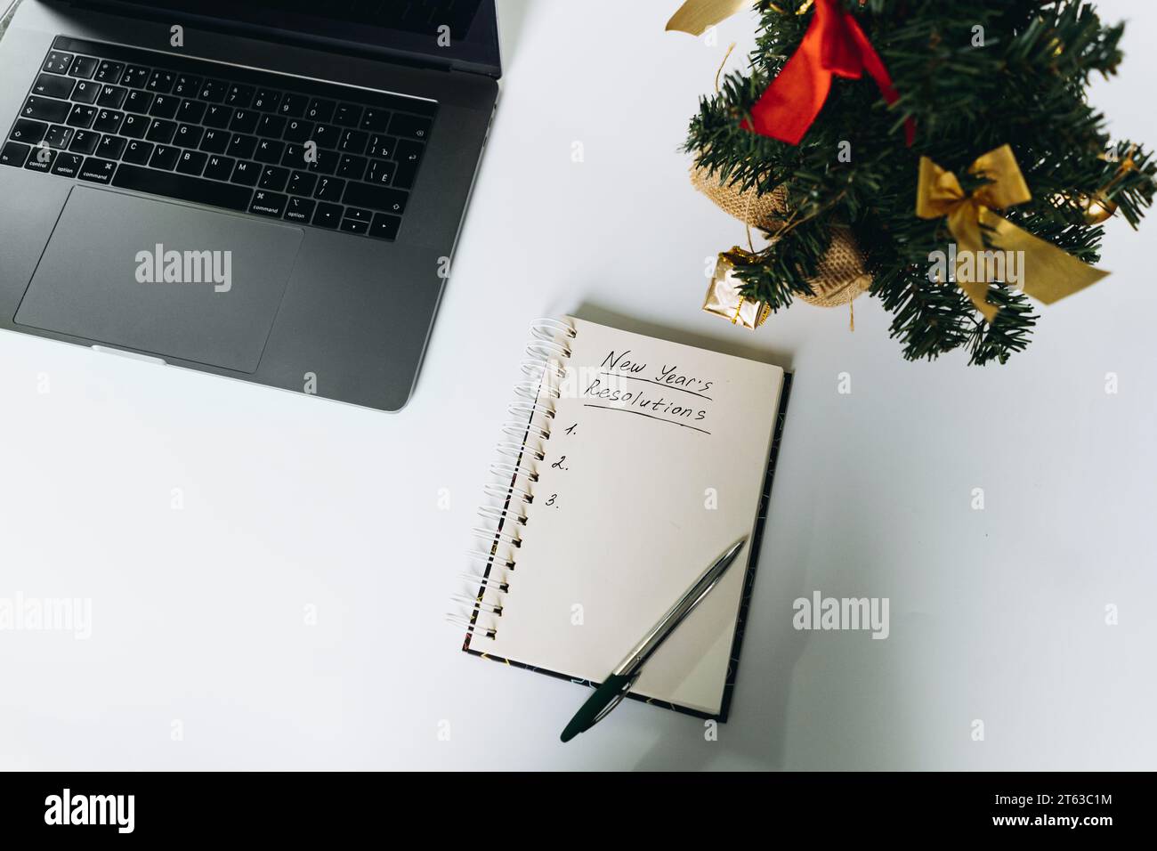 open notepad with resolutions for new 2024 year text. Near laptop and ...