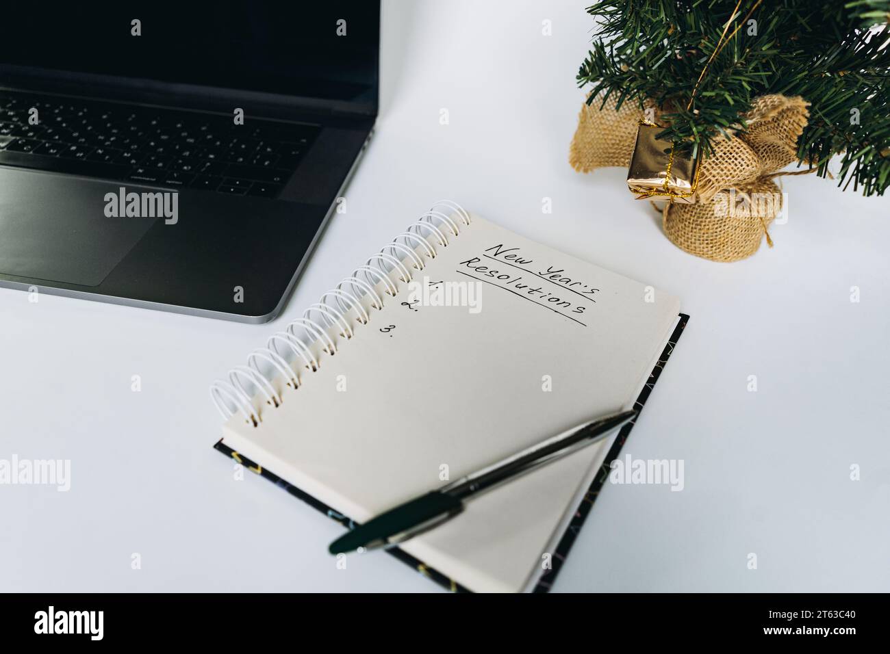 open notepad with resolutions for new 2024 year text. Near laptop and ...