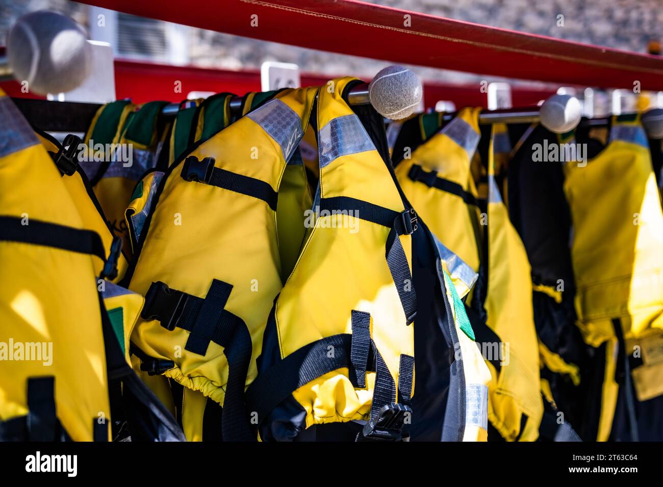 Yellow life vests for people safety for sea water activities. Jackets ...