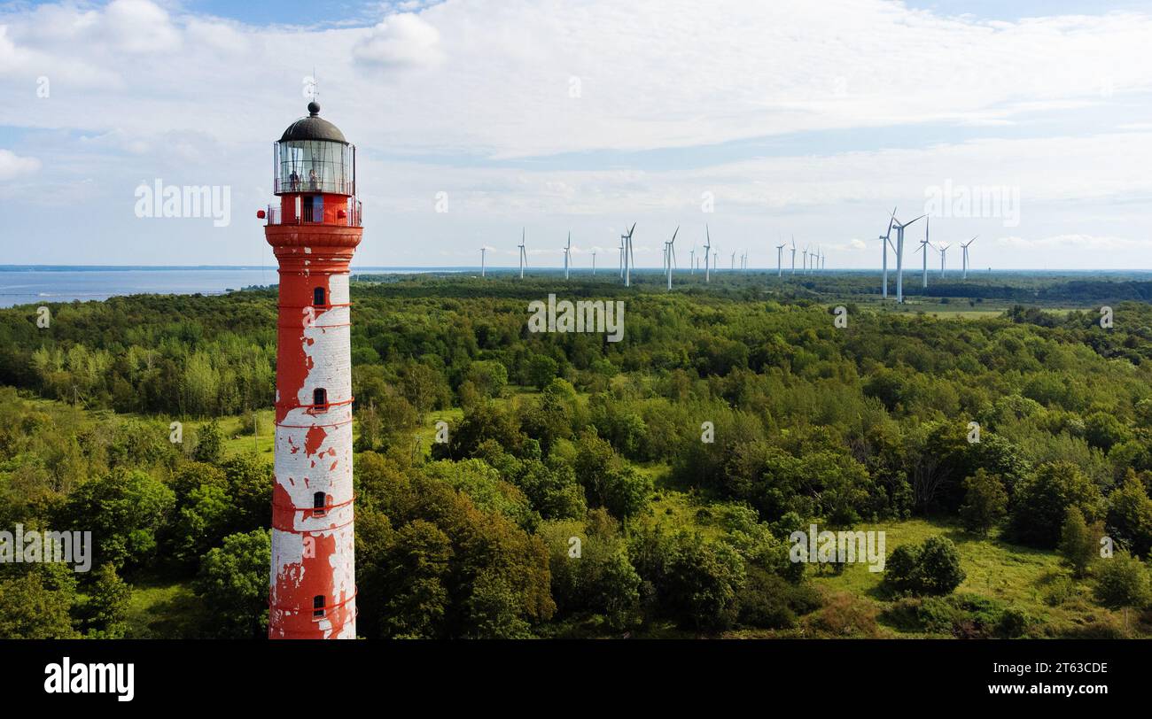 aerial view of old lighthouse and windmill farm near the Baltic sea ...