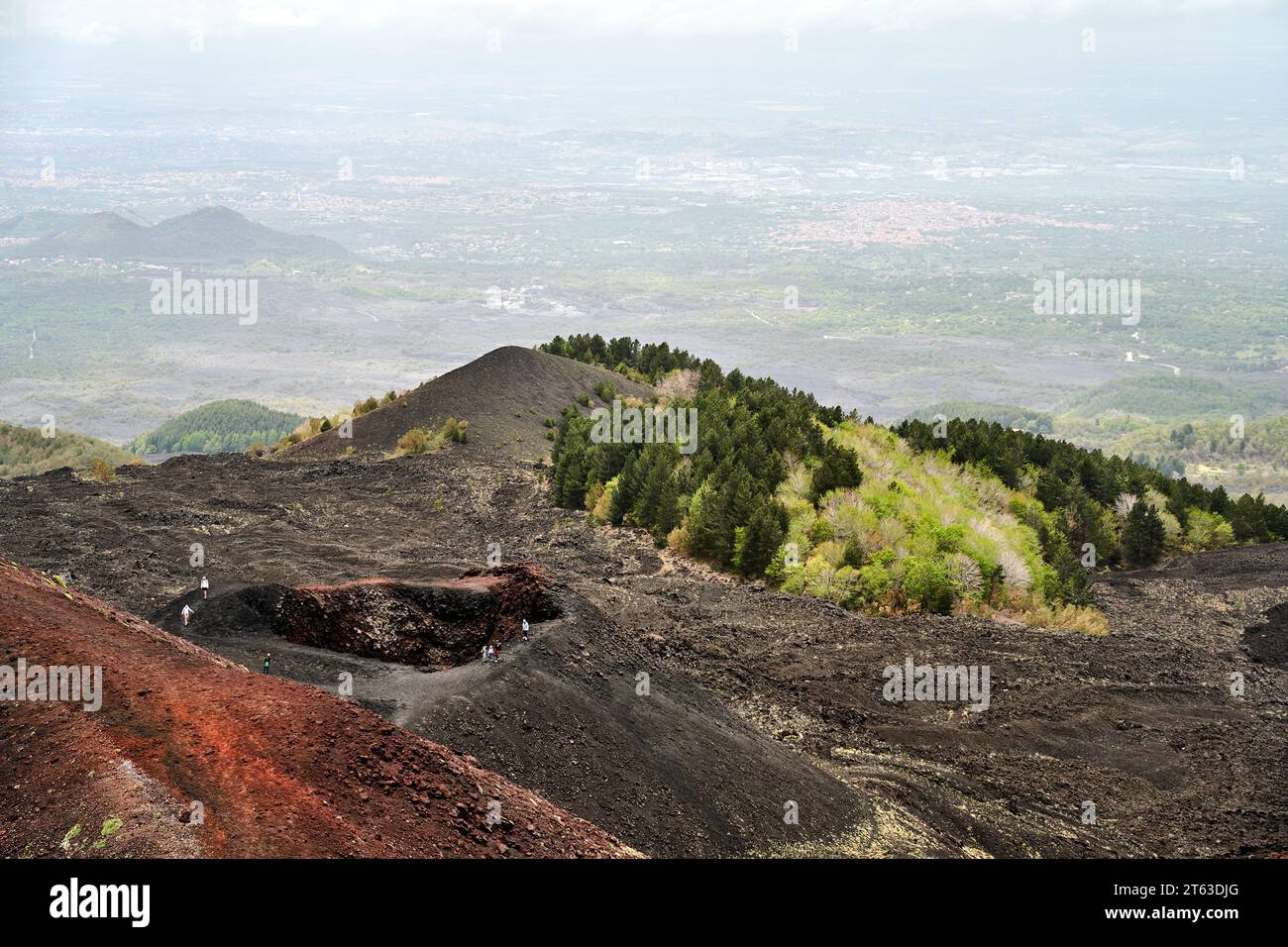Solidified lava and old craters on the slope of the active volcano Etna ...