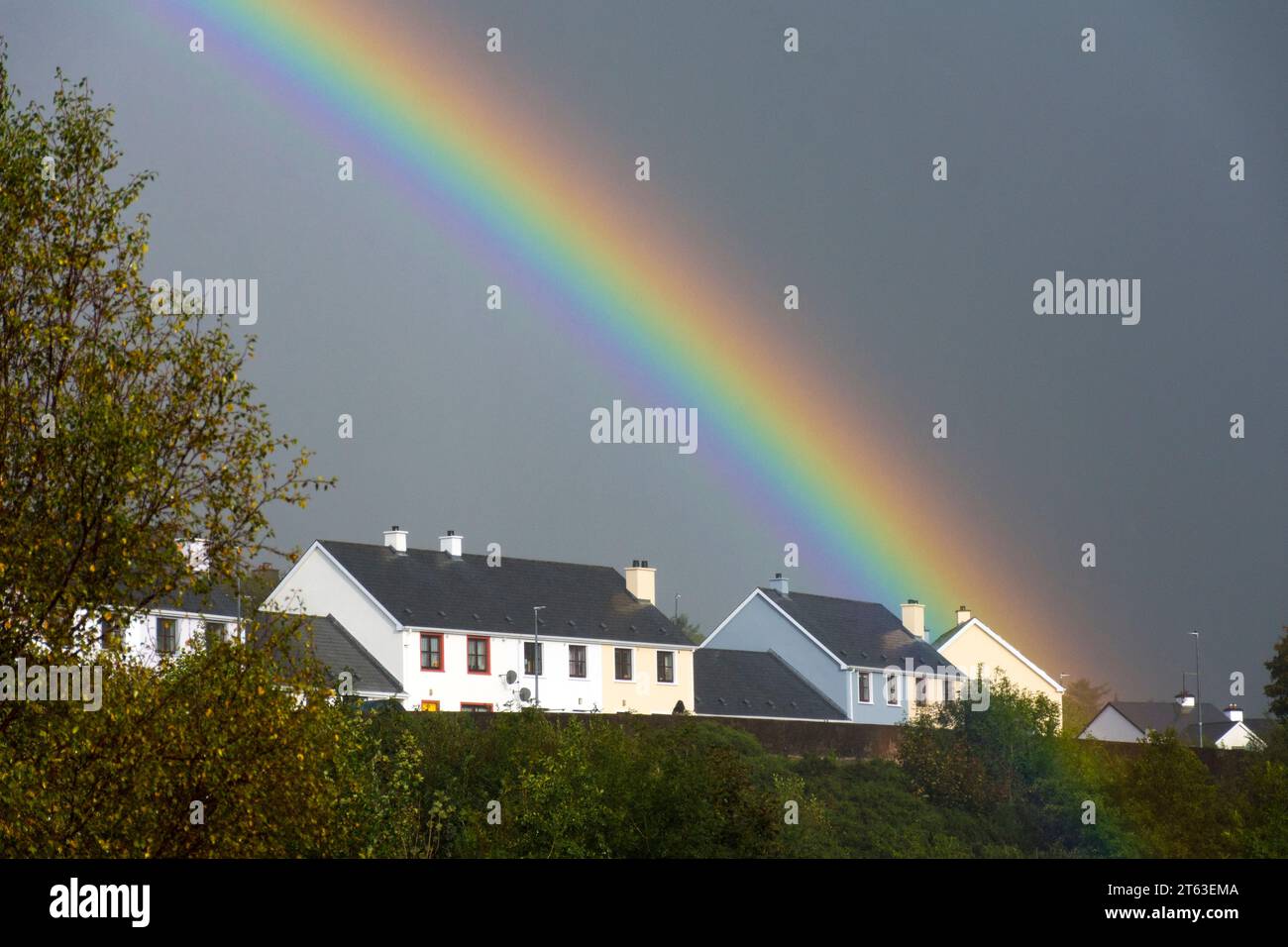 Rainbow over social housing in Ardara, County Donegal, Ireland Stock ...