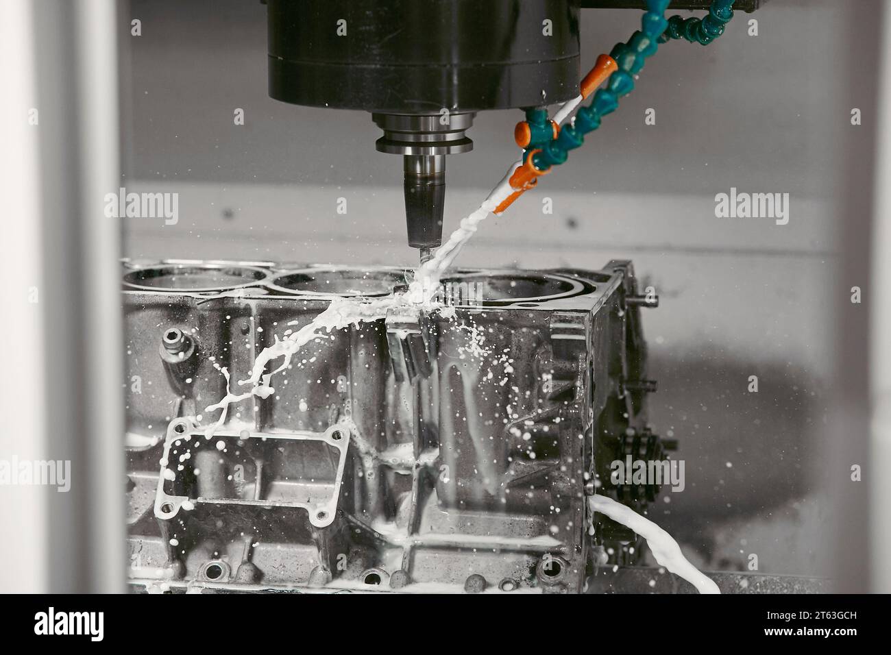 High precision cnc milling machine makes holes in the car engine Stock ...