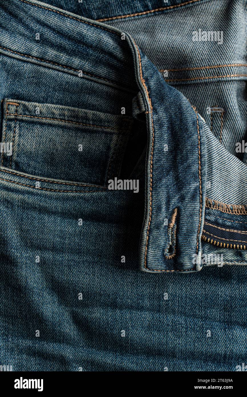 A detailed shot capturing the pocket and stitching details of a blue ...