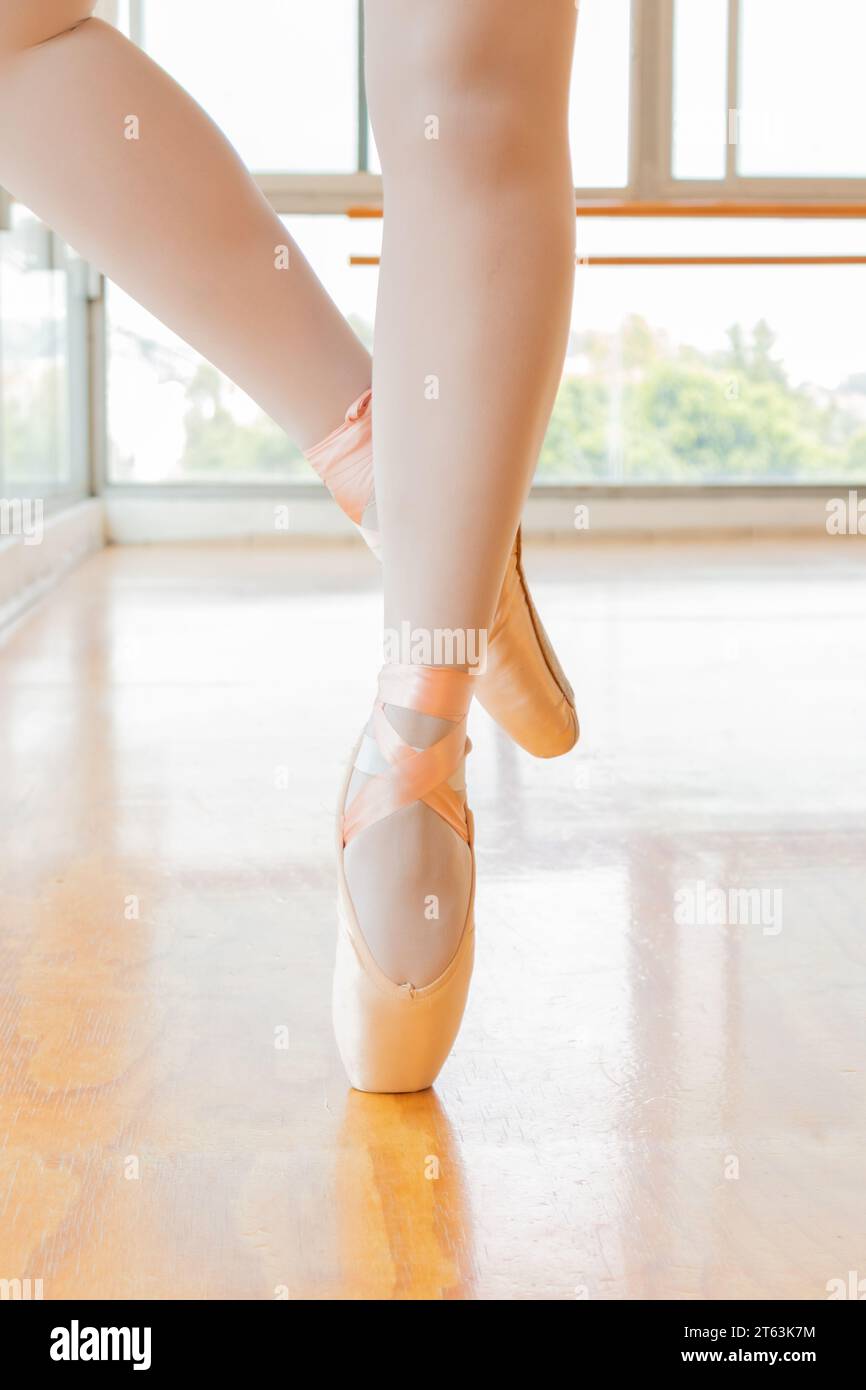 Anonymous ballet dancer's legs are elegantly poised in point shoes ...