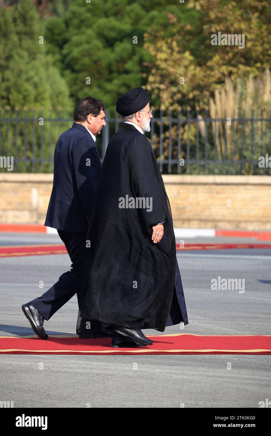 Tehran, Iran. 8th Nov, 2023. Iranian President EBRAHIM RAISI (R) walks ...