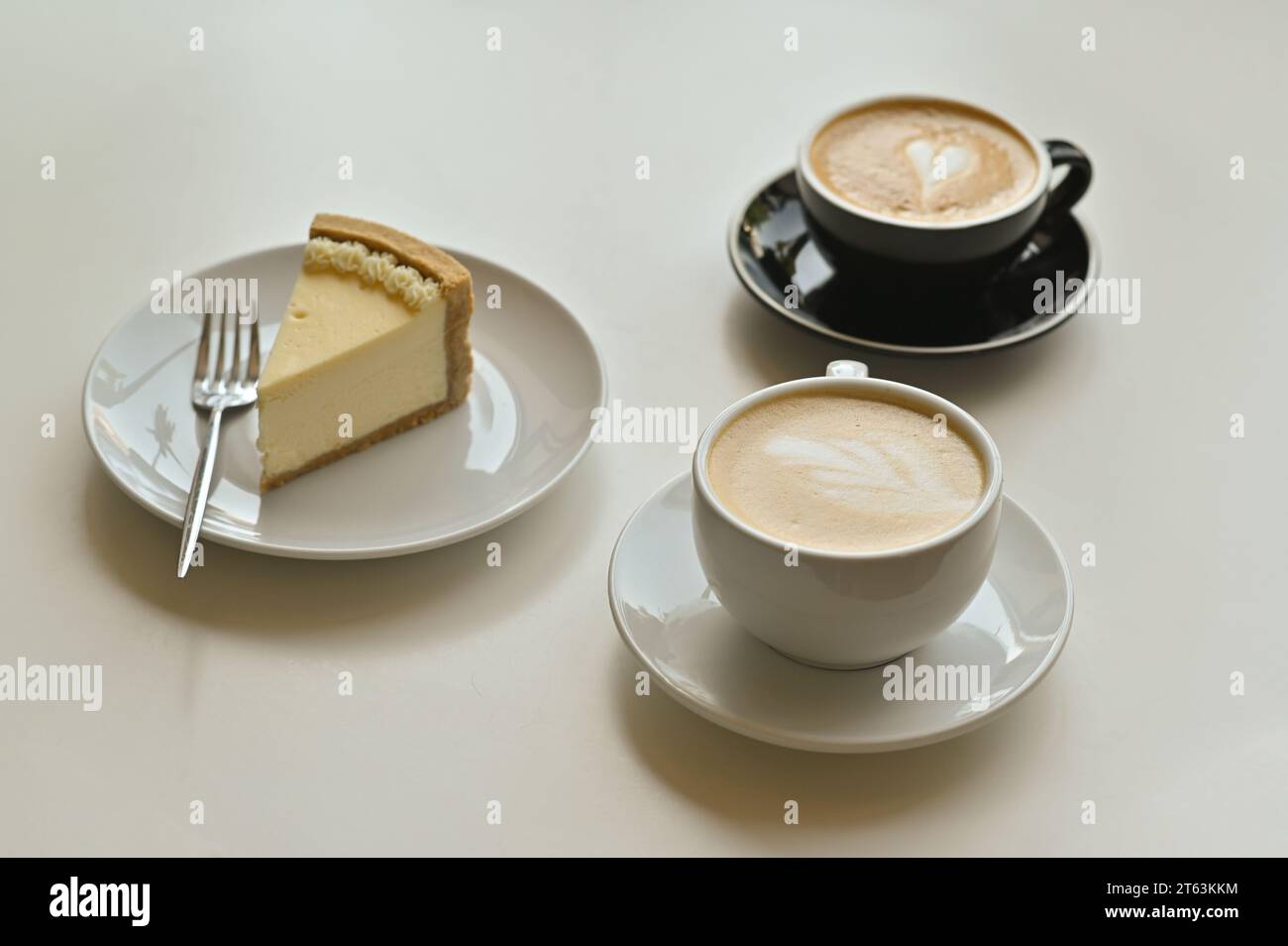 two cups of coffee latte with cake Stock Photo - Alamy