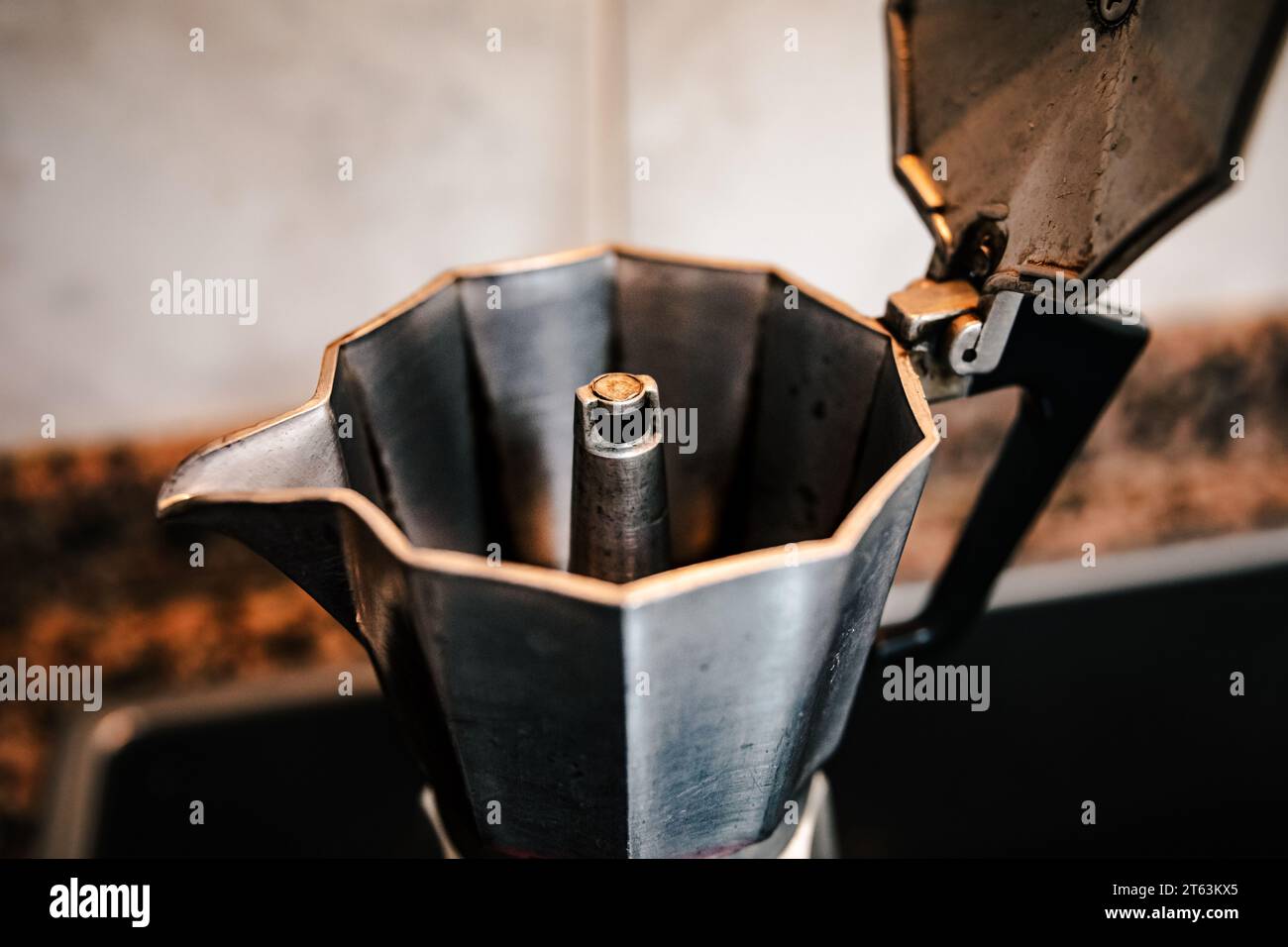 Close-up of stainless steel stovetop espresso maker placed on sleek ...