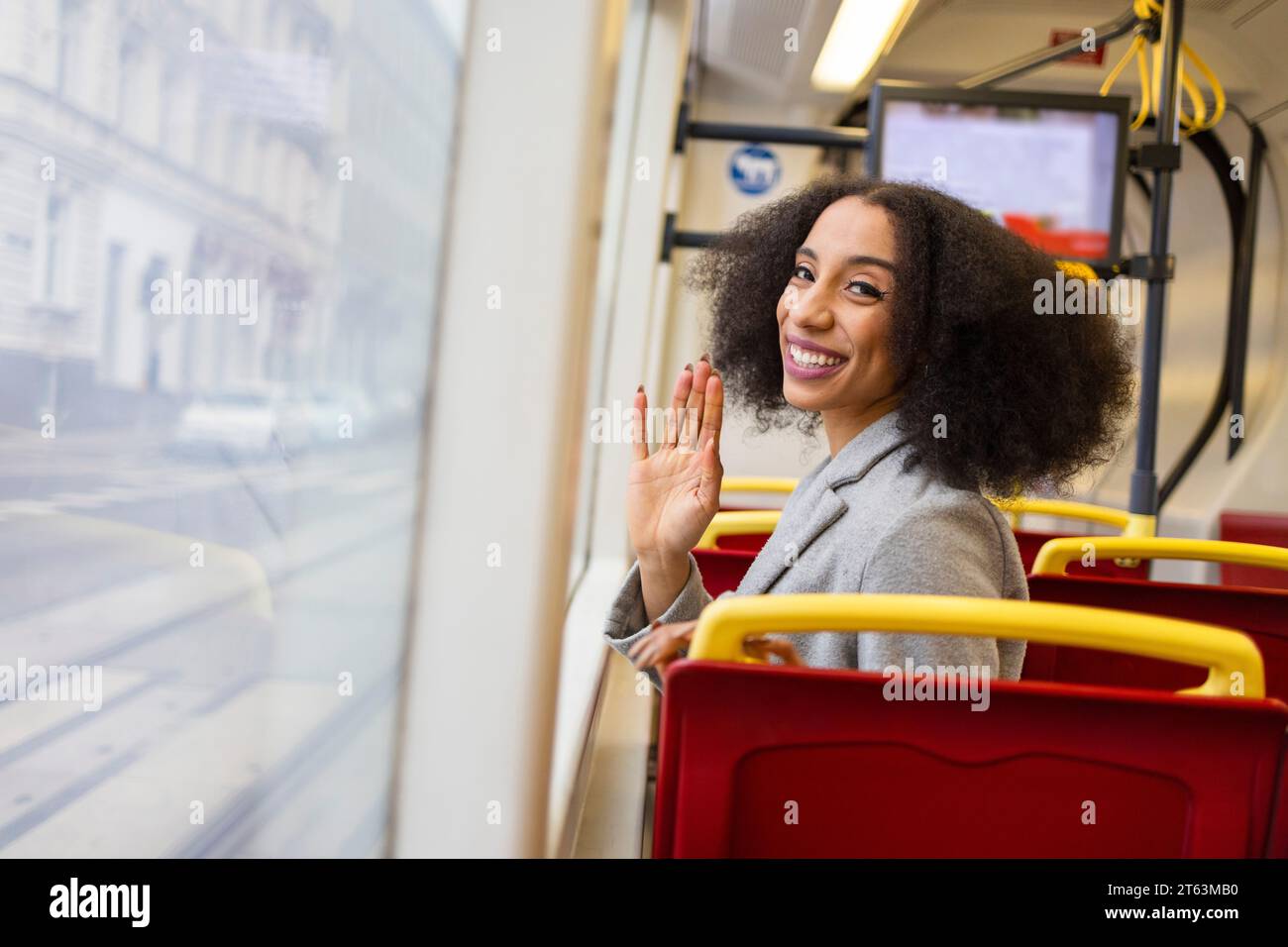 Woman waving bus hi-res stock photography and images - Alamy