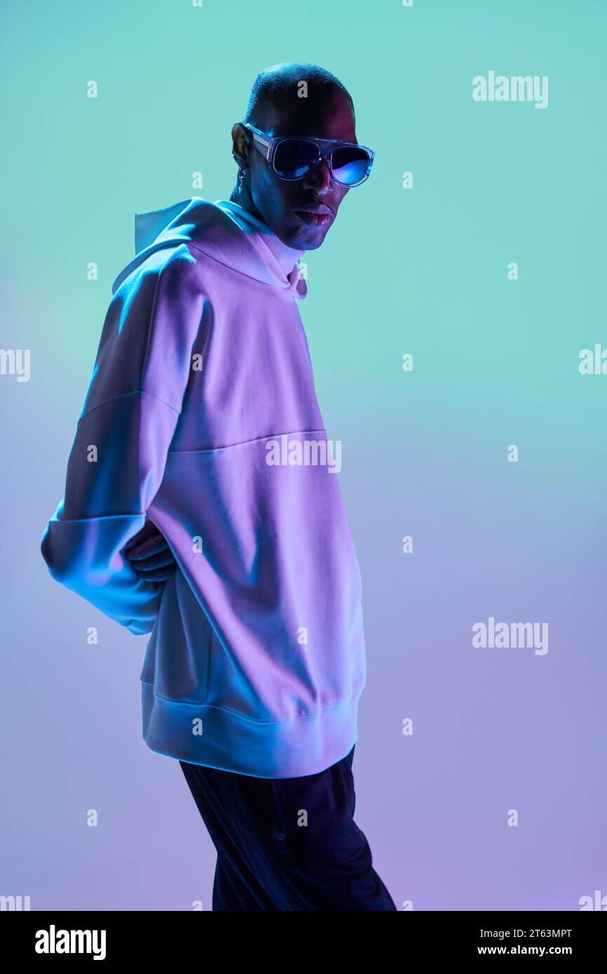 Side view of serious African American bald man standing with hands on ...