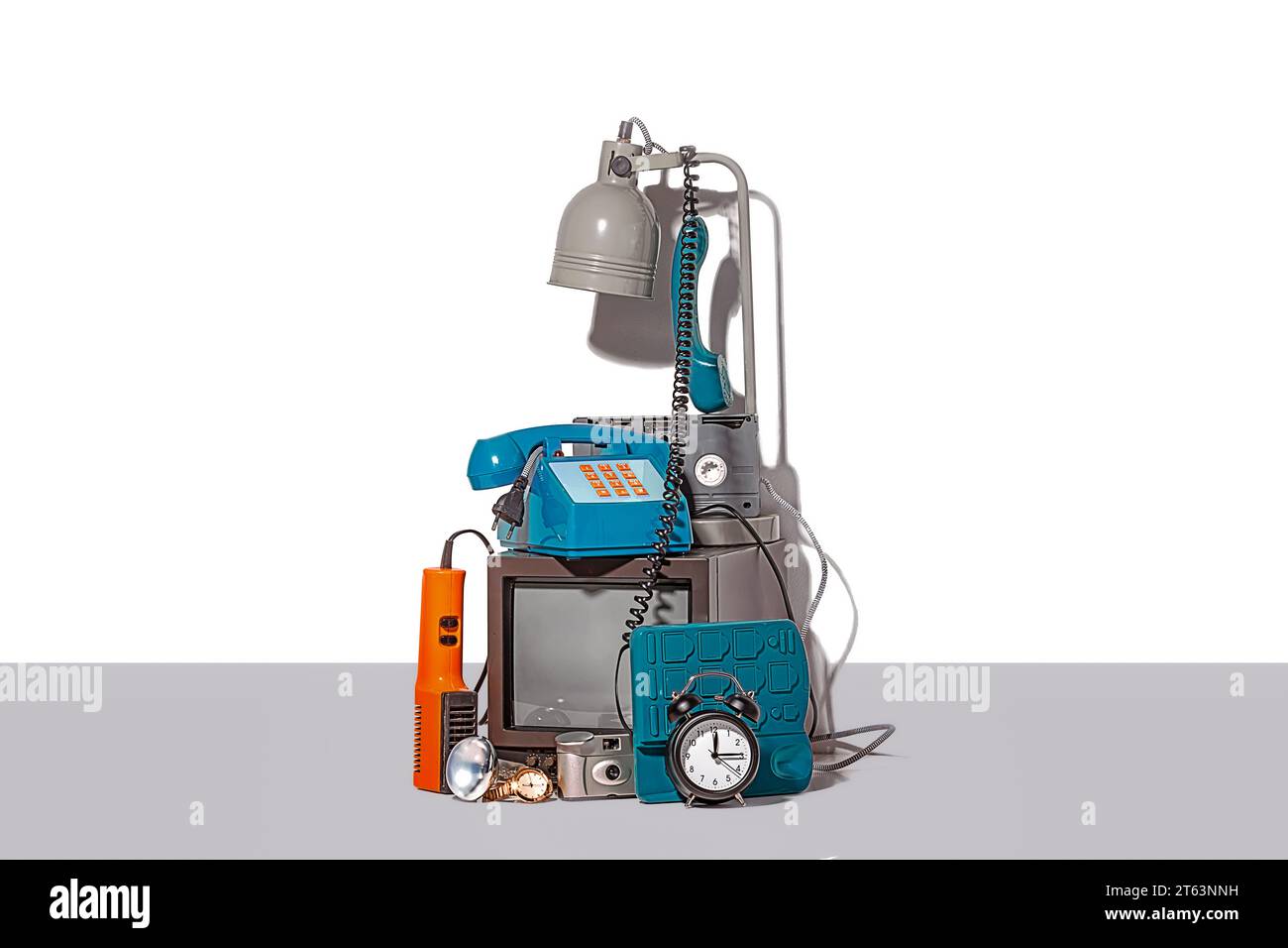 A curated collection of vintage technology items against a white ...