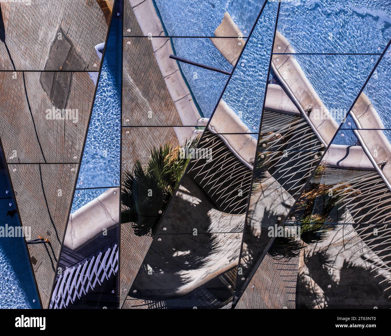 Top-down view of an urban plaza with glass panels, swimming pool, and ...