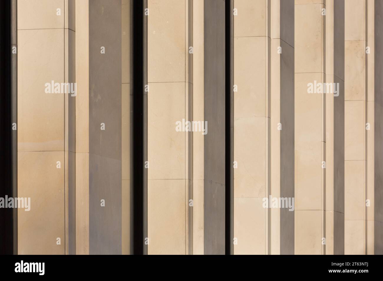 A close-up of vertical architectural panels with varying shades of ...