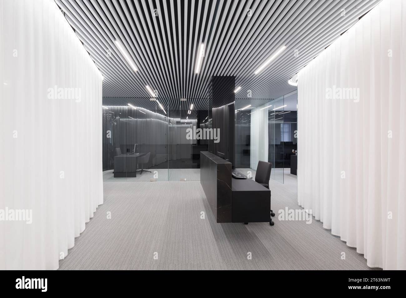 Contemporary office space featuring bold black and white design ...