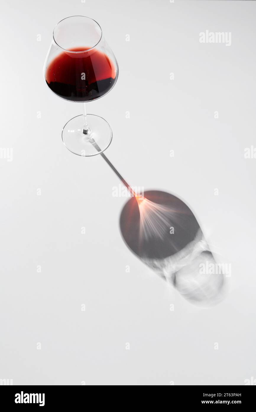 Black and red reflection of wineglass on thin stem Stock Photo - Alamy