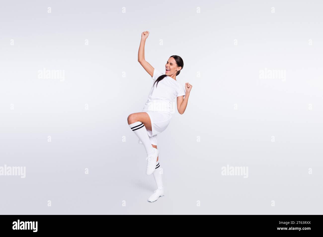 Full length photo of happy cheerful young woman raise hands winner ...