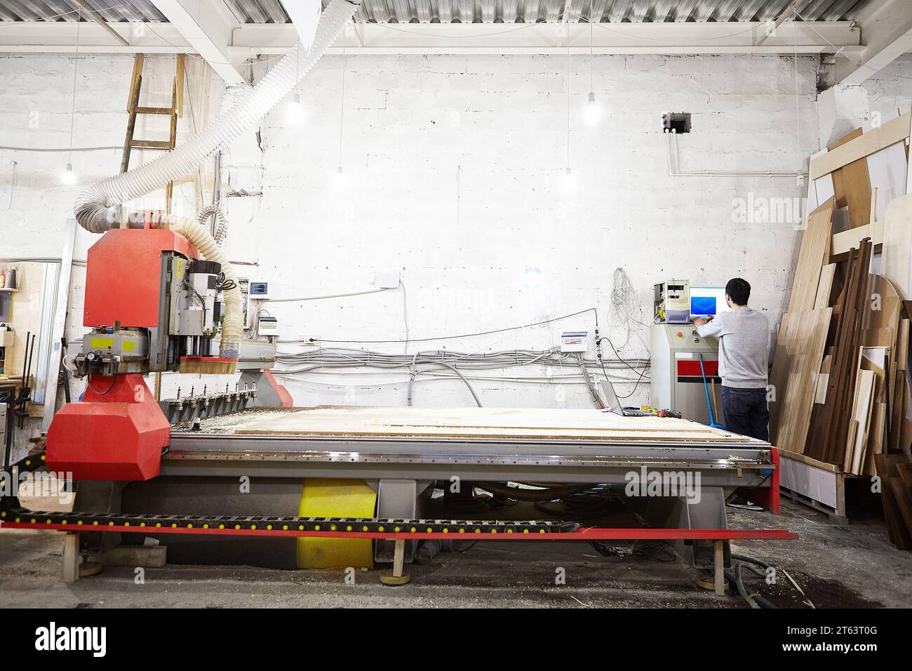 Cnc machine at carpentry workshop. Cutting wood with various router ...