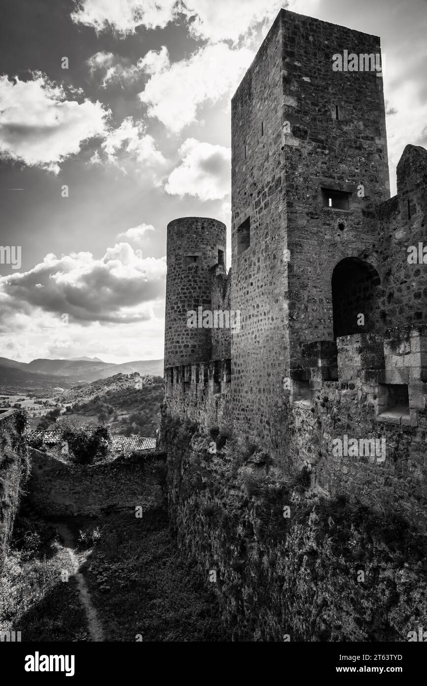 Facade and side tower of the medieval castle of Frias in a dramatic ...