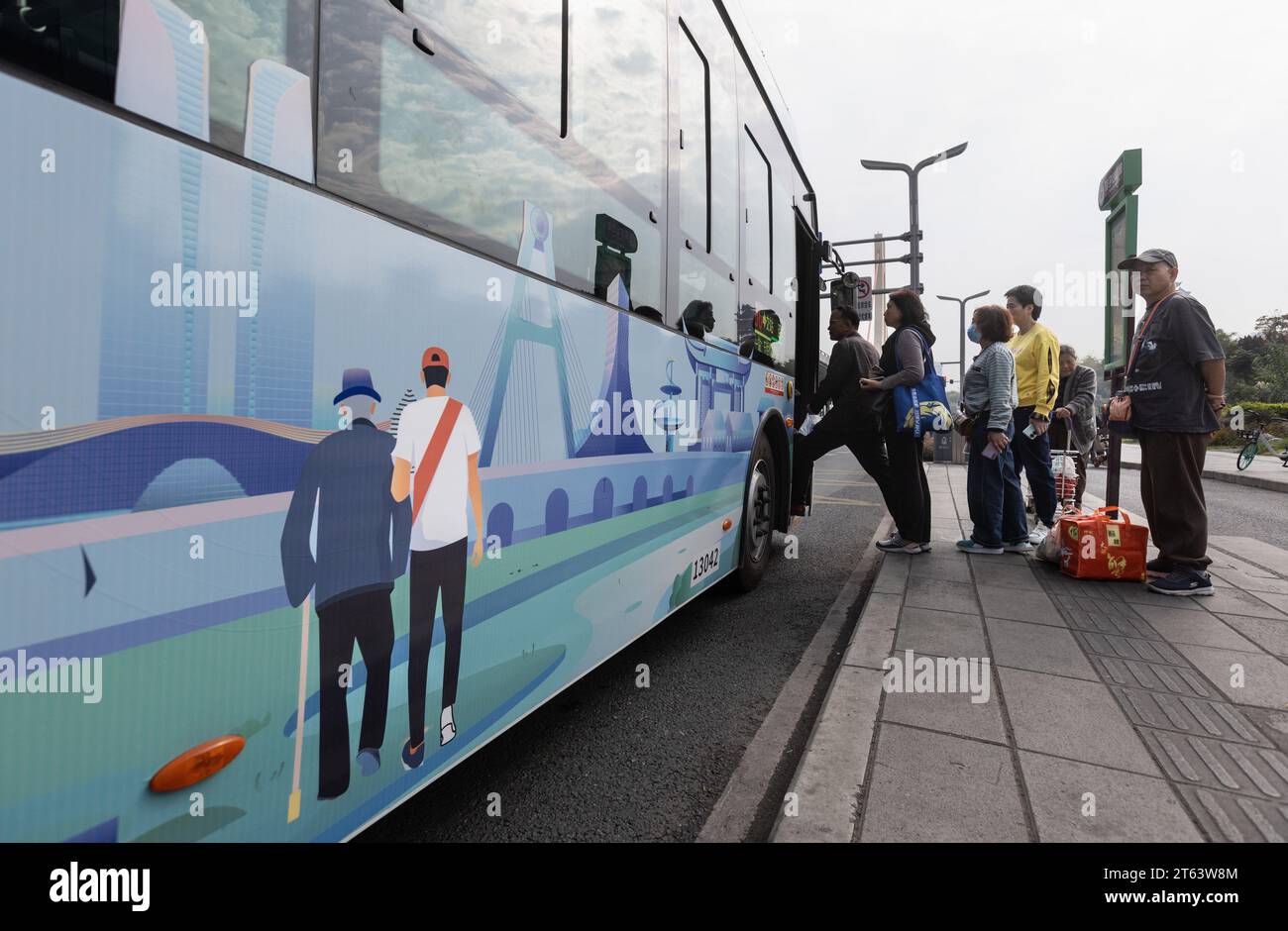 Chengdu, China's Sichuan Province. 7th Nov, 2023. People board a bus of ...