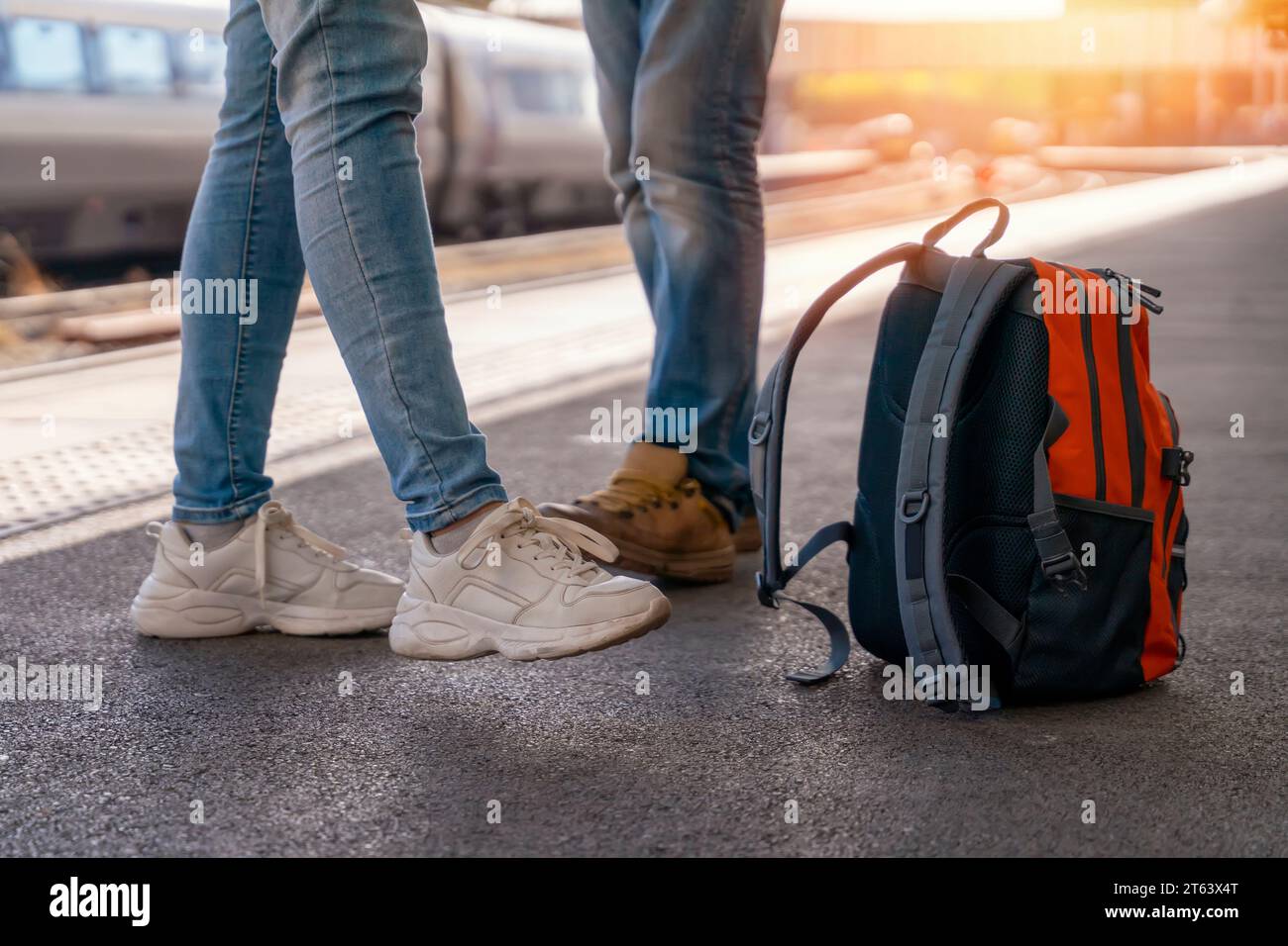 Traveler with a backpack waiting for a train at the train station ...