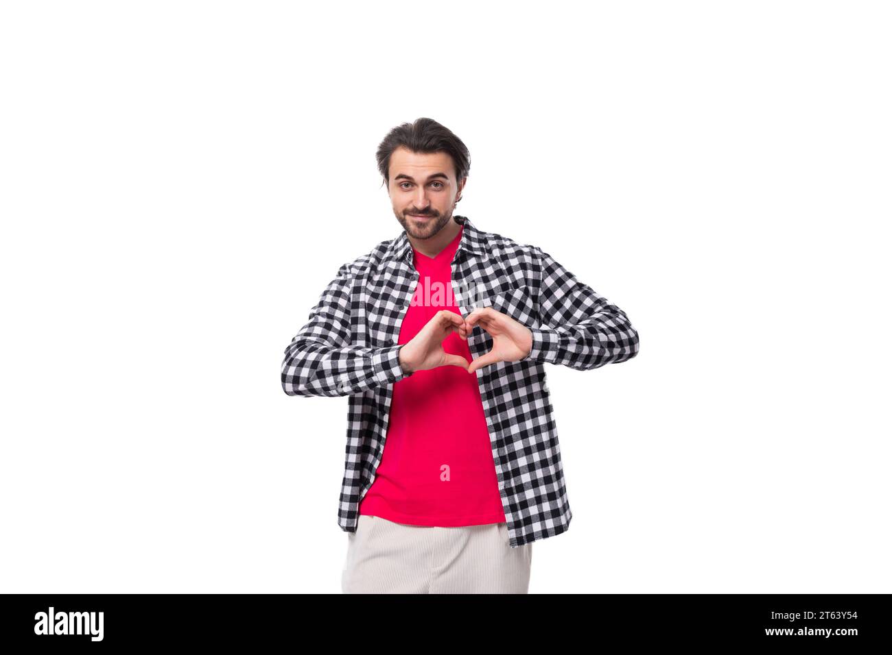 handsome pleasant young european man with black hair and beard in a ...