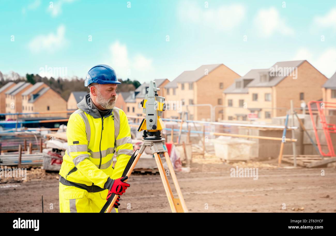 Surveyor builder site engineer with theodolite total station at ...