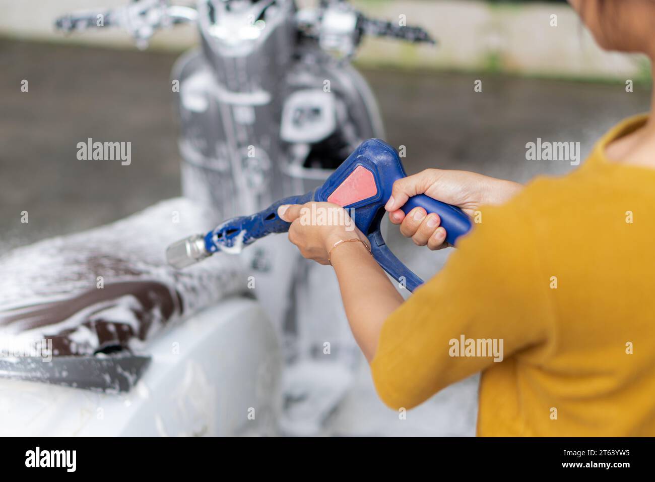 cleaning of the motorcycle at the car wash by water and foam Stock ...