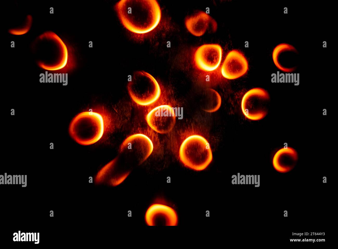 Beautiful liquid red, orange fire texture on black background. Fire in ...