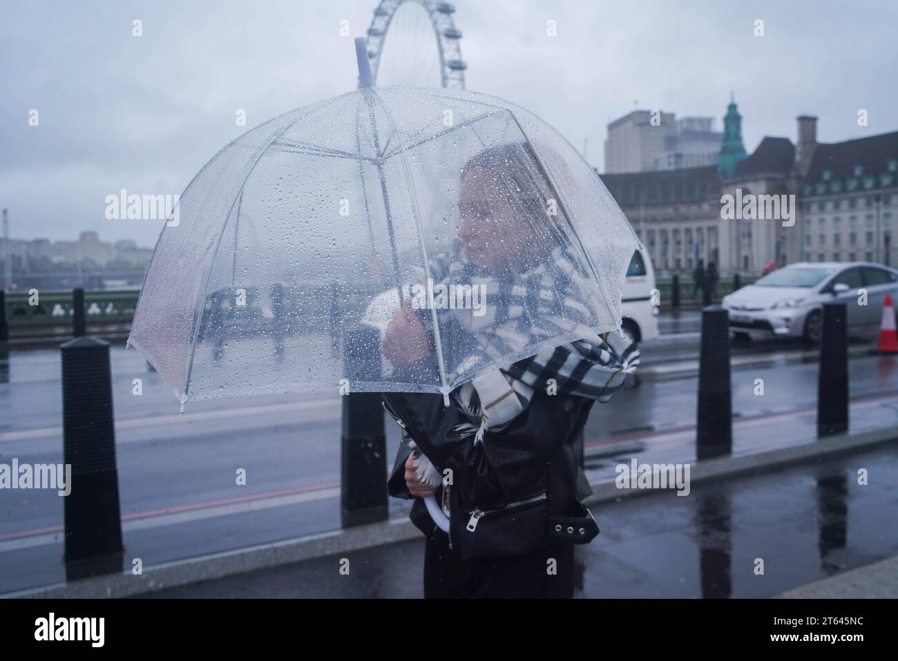 London, UK. 8 November 2023. Pedestrians on Westminster Bridge are ...