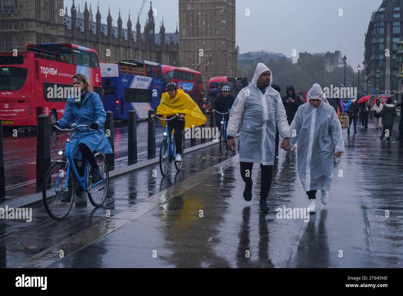 London, UK. 8 November 2023. Pedestrians and cyclists on Westminster ...