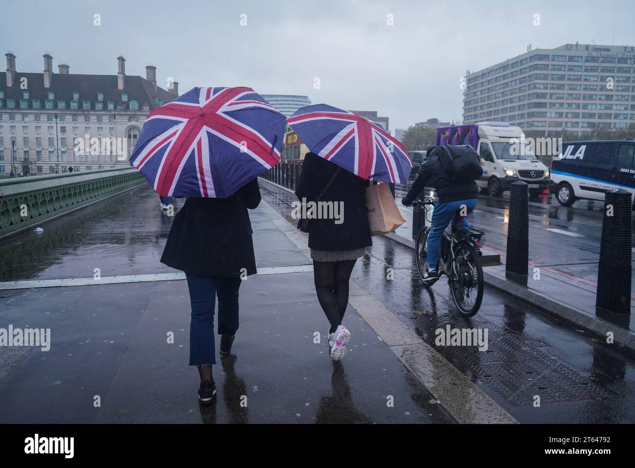 London, UK. 8 November 2023. Pedestrians on Westminster Bridge are ...