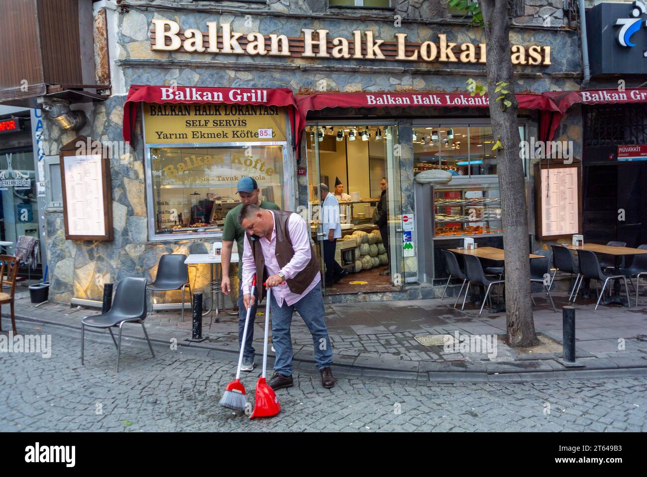 Istanbul, Turkey, 11th of October 2023, A turkish man cleaning in front ...