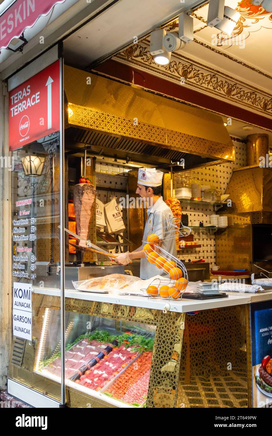 Istanbul, Turkey, A male employee cutting a kebab at a restaurant ...