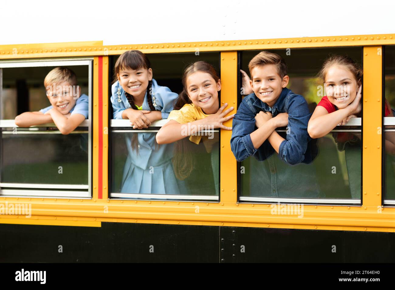 Joyful kids looking out from their school bus window Stock Photo - Alamy
