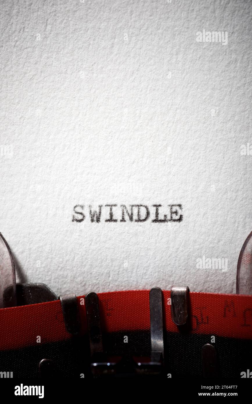 Swindle word written with a typewriter Stock Photo - Alamy