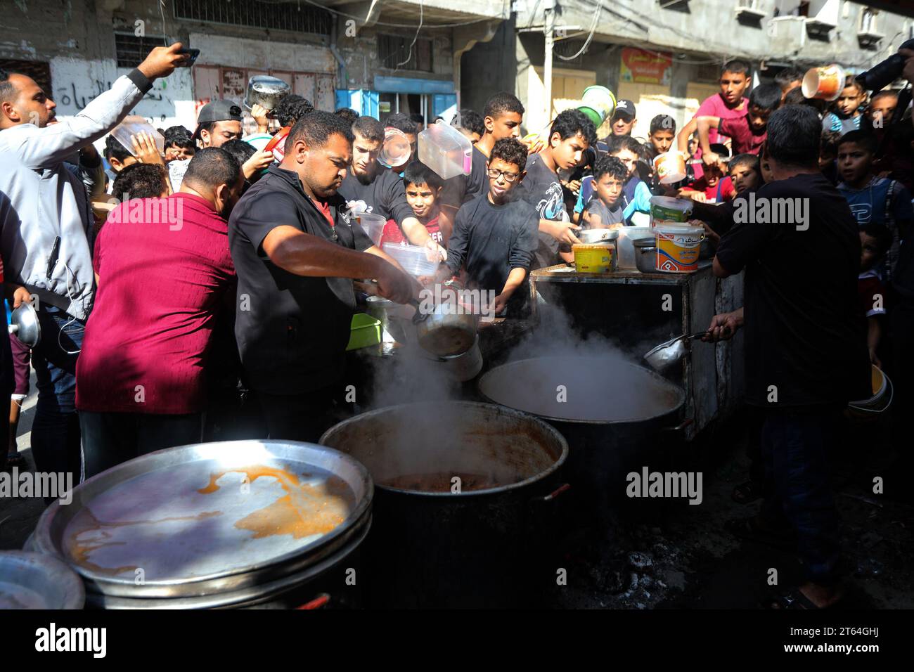 Gaza, Gaza. 08th Nov, 2023. Palestinian children queue to receive a ...